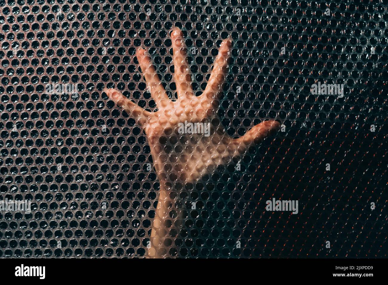social anxiety woman hand trapped bubble wrap Stock Photo - Alamy