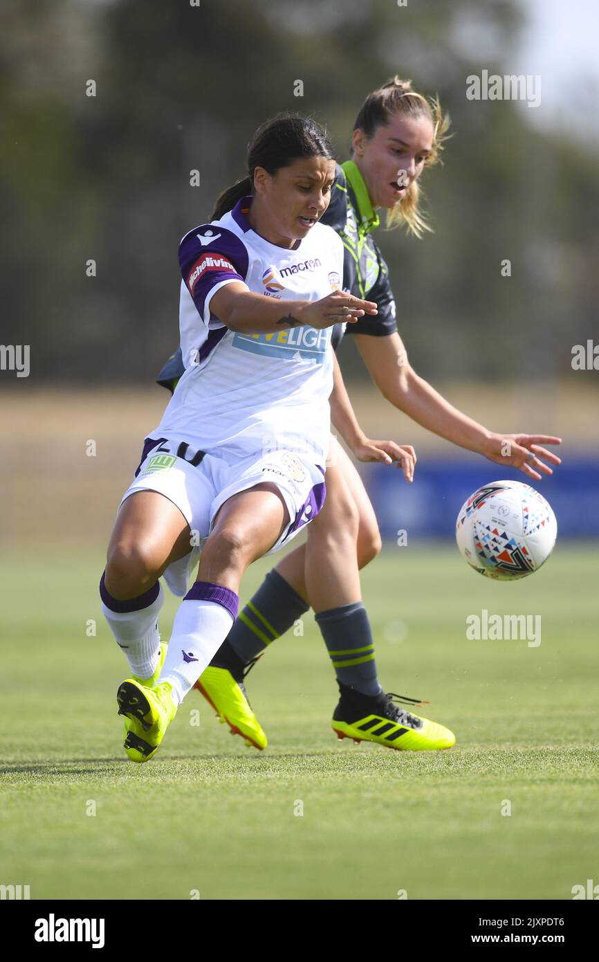 Nikola Orgill of Canberra United (right) fights for the ball with ...