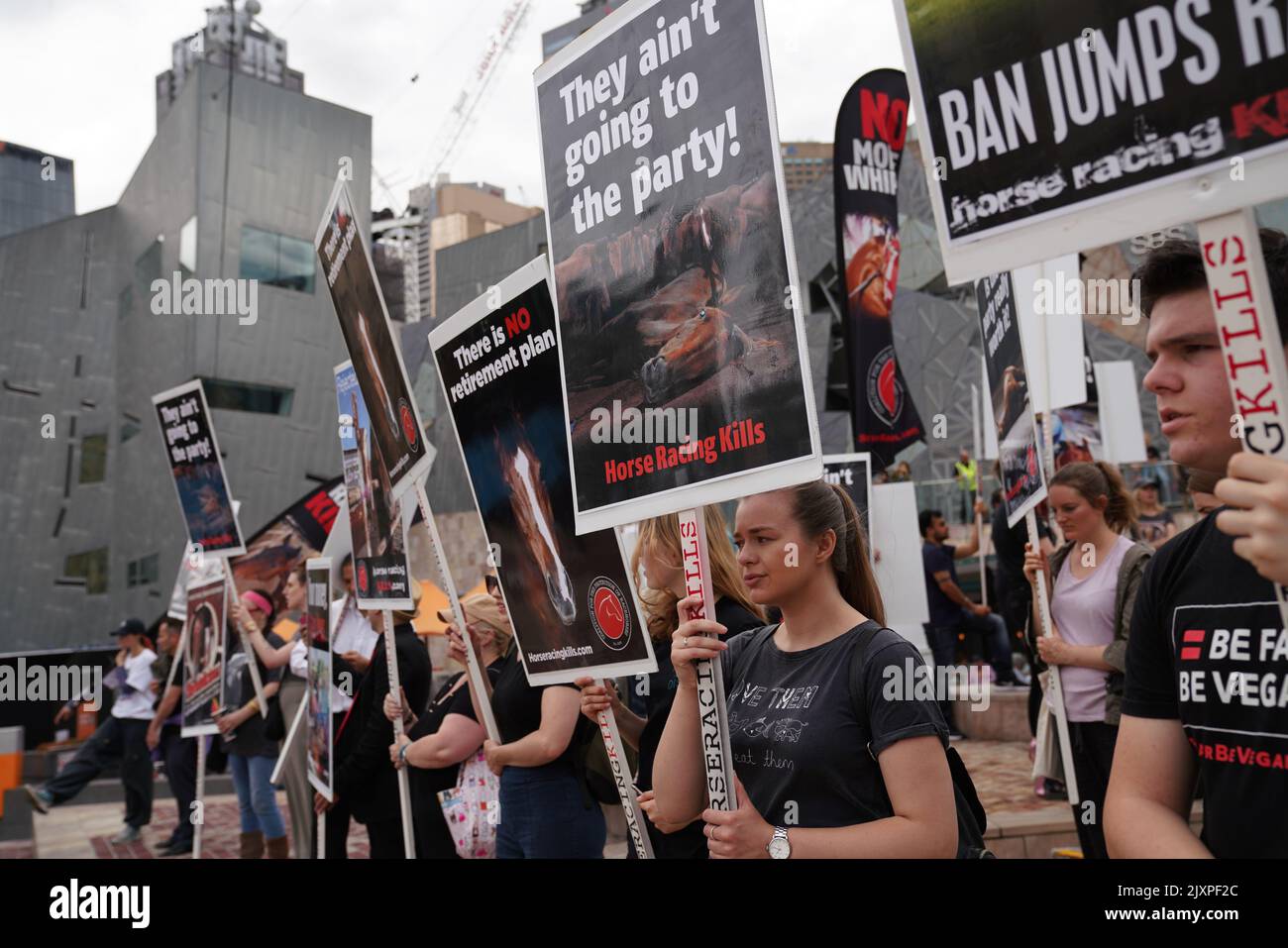Protestors are seen during the Melbourne Cup parade in Melbourne ...