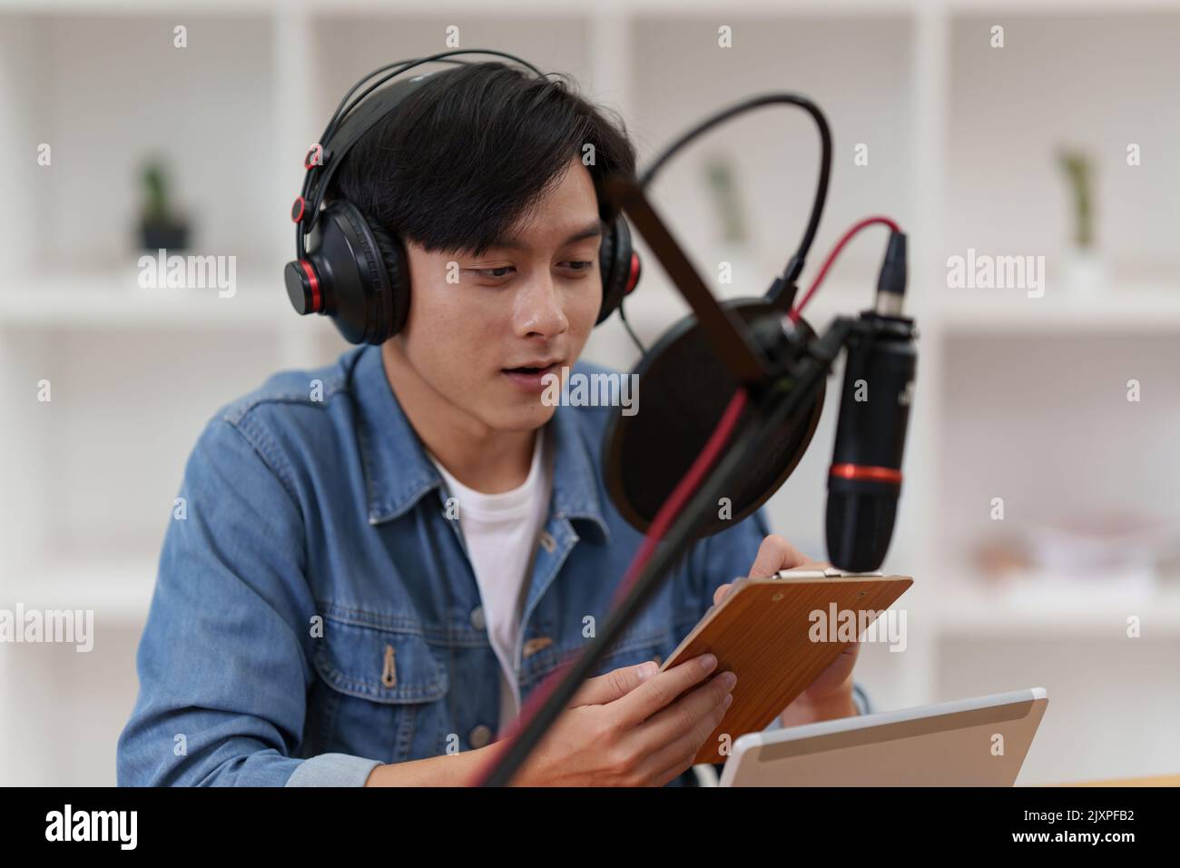 Handsome male podcaster talking hi-res stock photography and images - Alamy