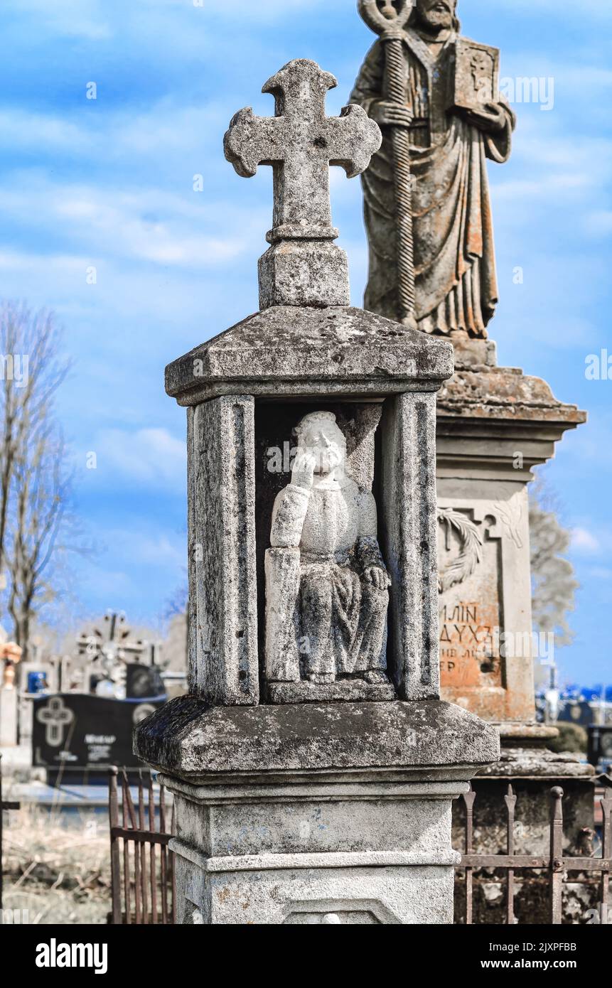 Tombstones of saints in small cemetery, Europe, Poland, Ukraine. Graves ...