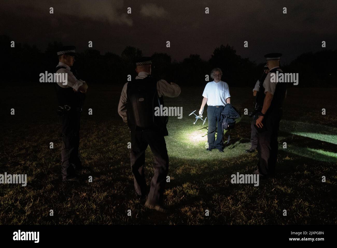 A man is seen being questioned by the police after trying to fly a ...