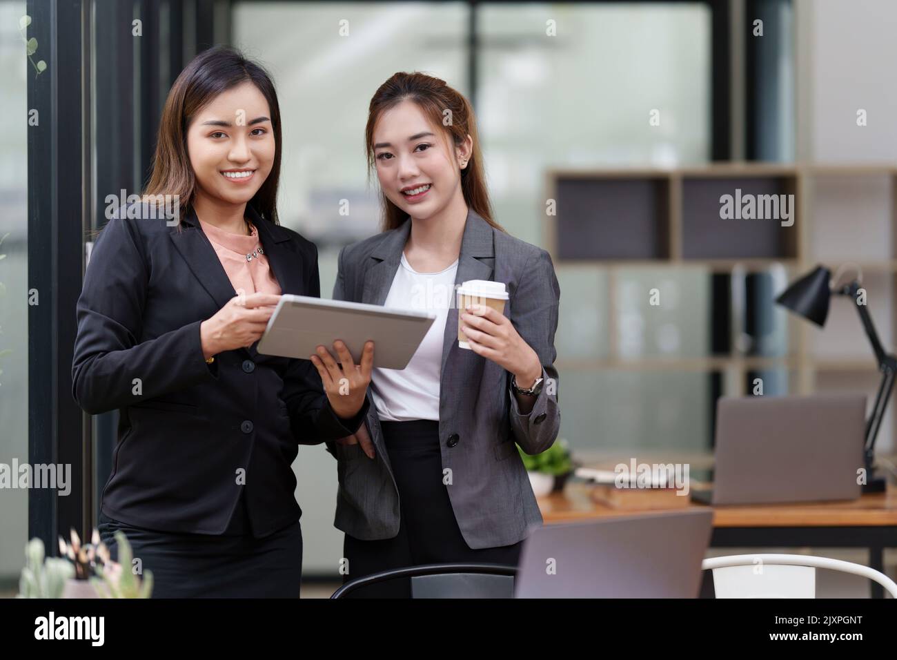Businesswoman using tablet during office hi-res stock photography and ...
