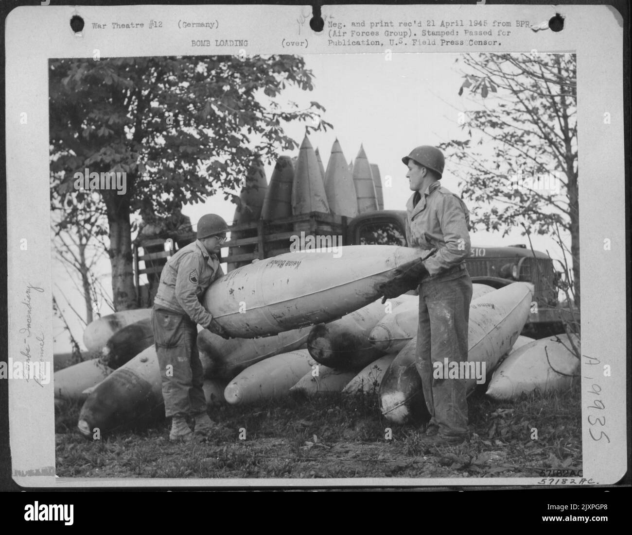 Ground Crewmen Unload Captured German Belly Tanks Preparatory To ...