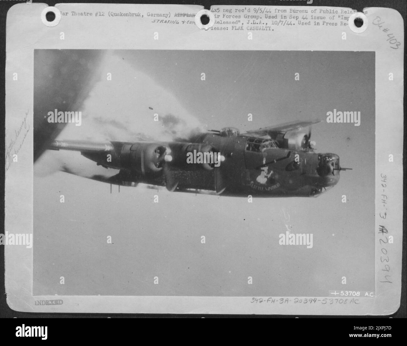 This consolidated B-24 Liberator is shown hit by flak over the target ...