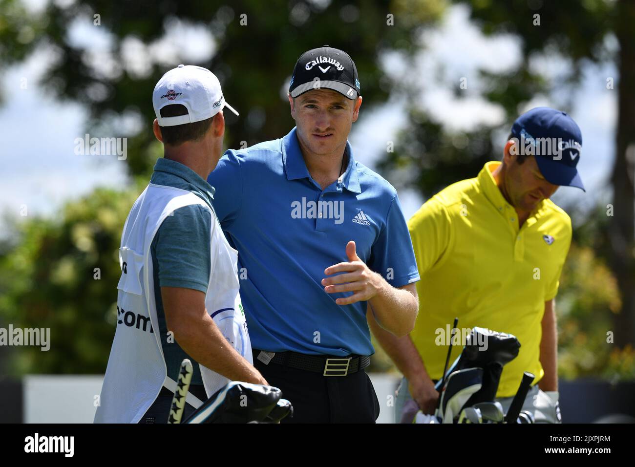 Nick Voke (centre) of New Zealand looks on during day one of the ...