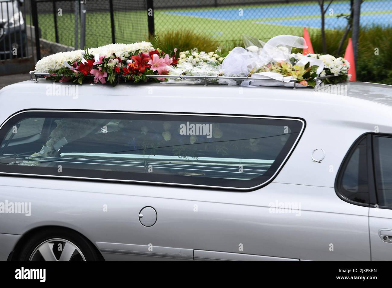 A casket is seen inside a hearse following the funeral service for ...