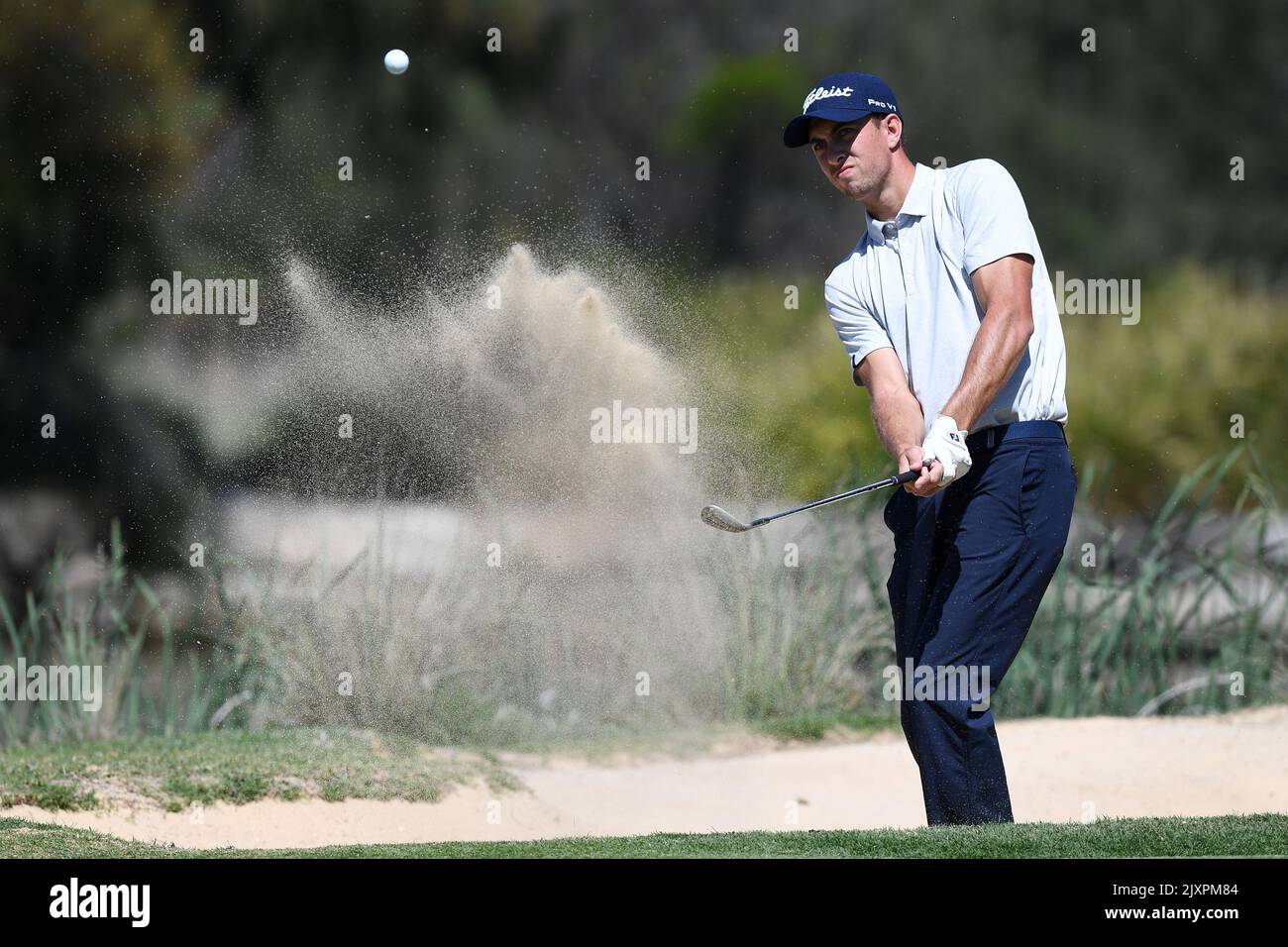 Justin Warren of NSW plays a shot from the sand trap on the 17th hole ...