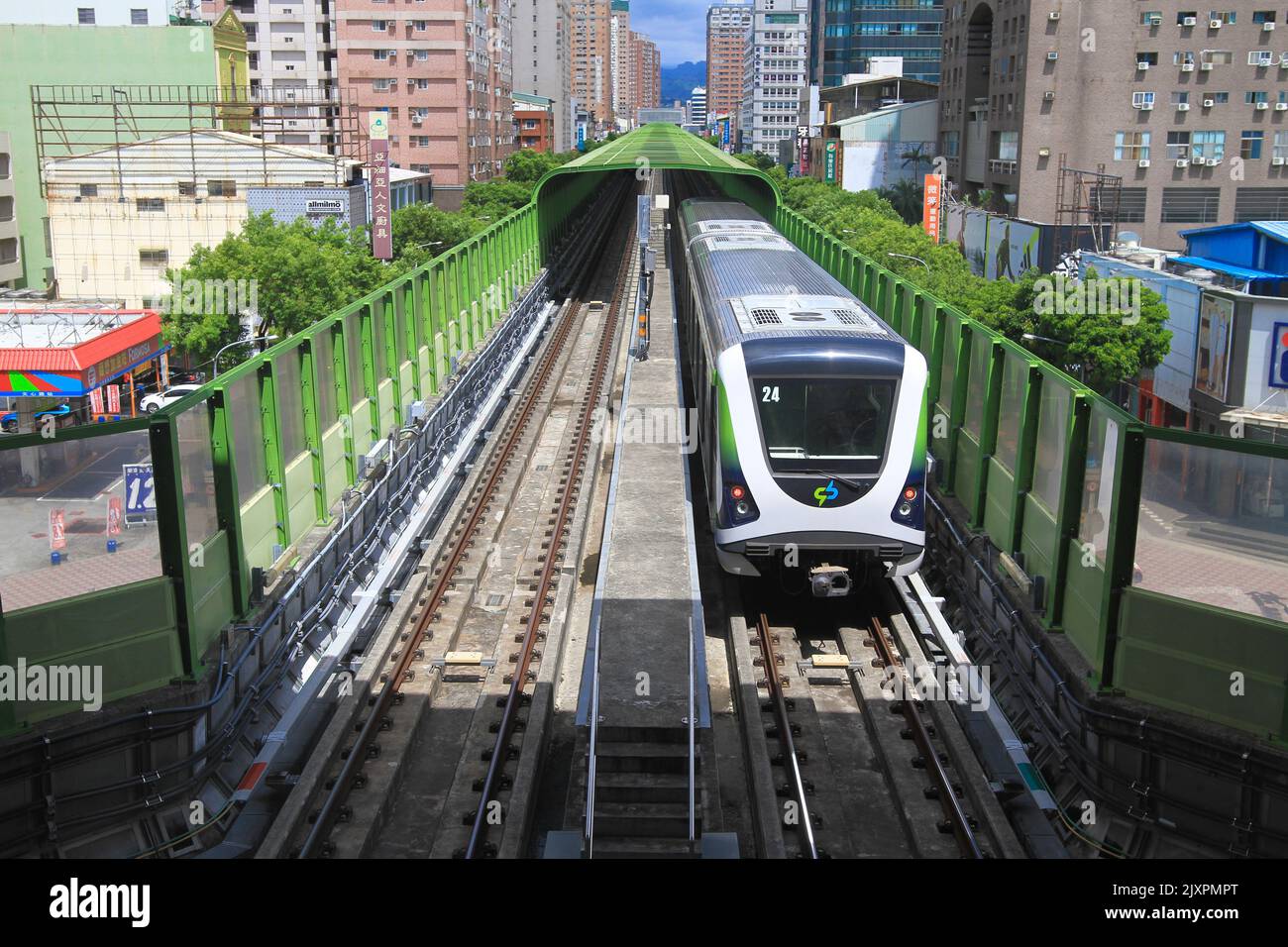 Taichung MRT train passes above the road Stock Photo - Alamy