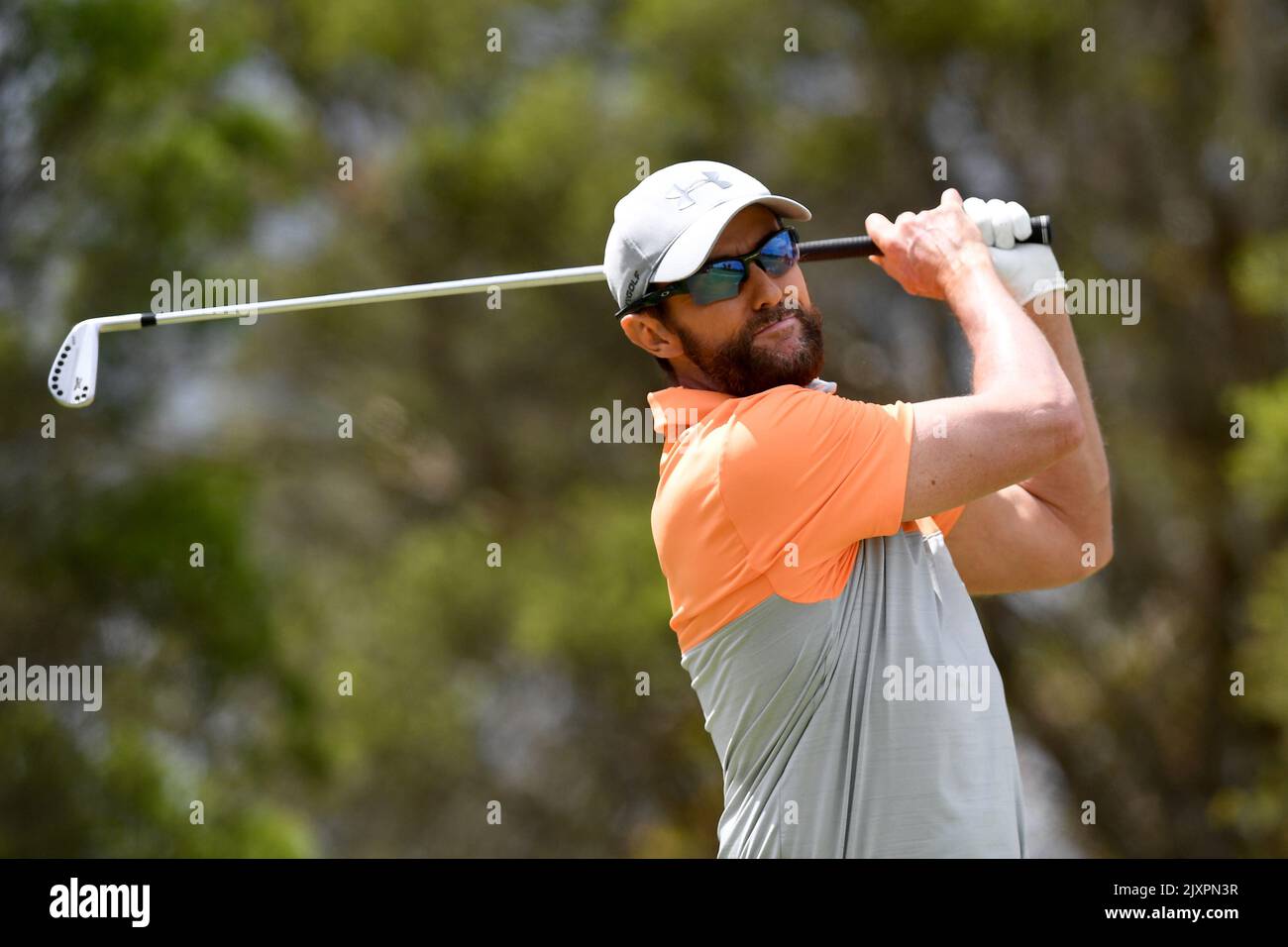 Mark Hensby of NSW plays a shot from the 14th tee during day three of ...
