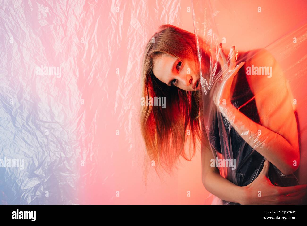 covid-19 self isolation worried woman polyethylene Stock Photo - Alamy