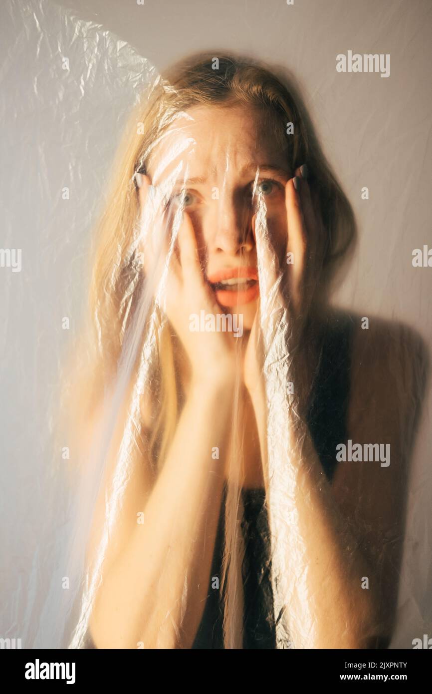 hopeless woman defocused portrait self isolation Stock Photo - Alamy