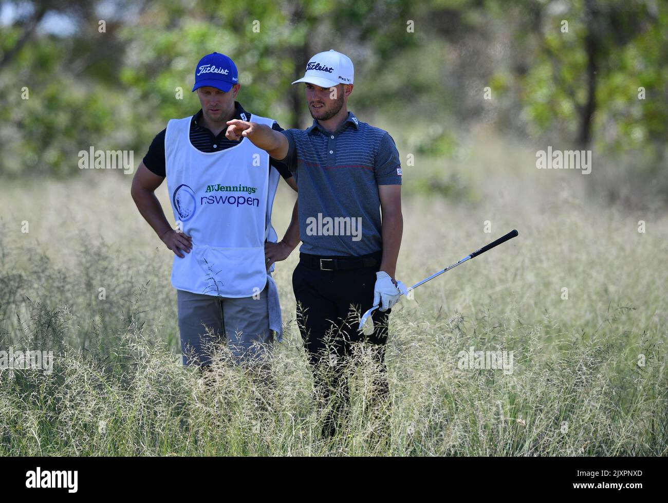 Golfer Blake Proverbs (right) of Queensland is seen with his caddie ...