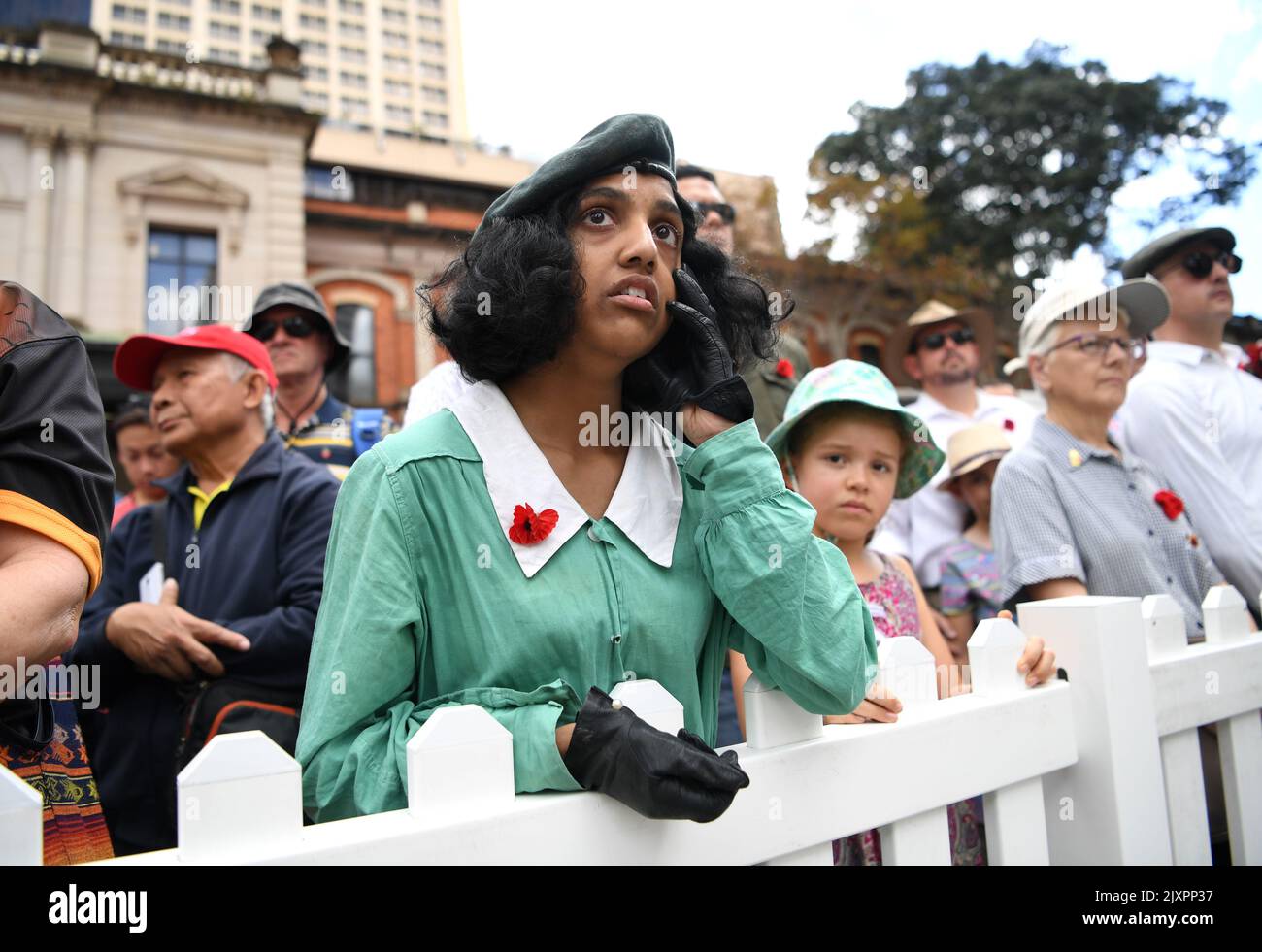 Mary De Zilva, dressed in WWI-era fashion, becomes emotional during a ...