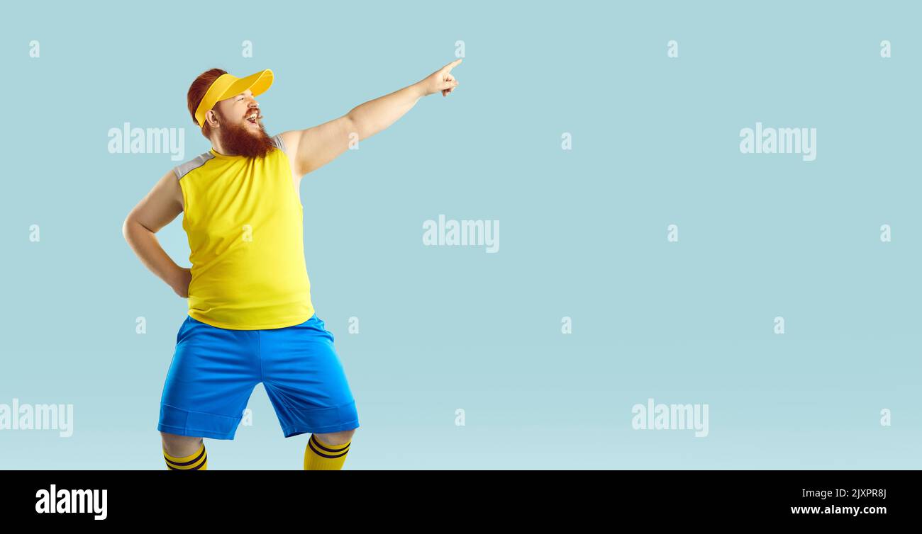 Wide shot of funny fat man point at copy space Stock Photo - Alamy