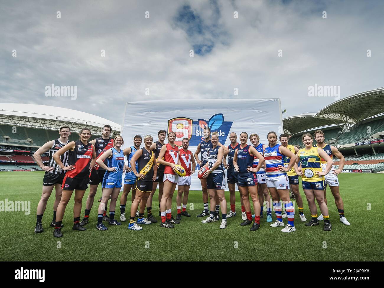 (L-R) Matthew Wright of Adelaide, Sam Davidson of Port Adelaide, Cooper ...