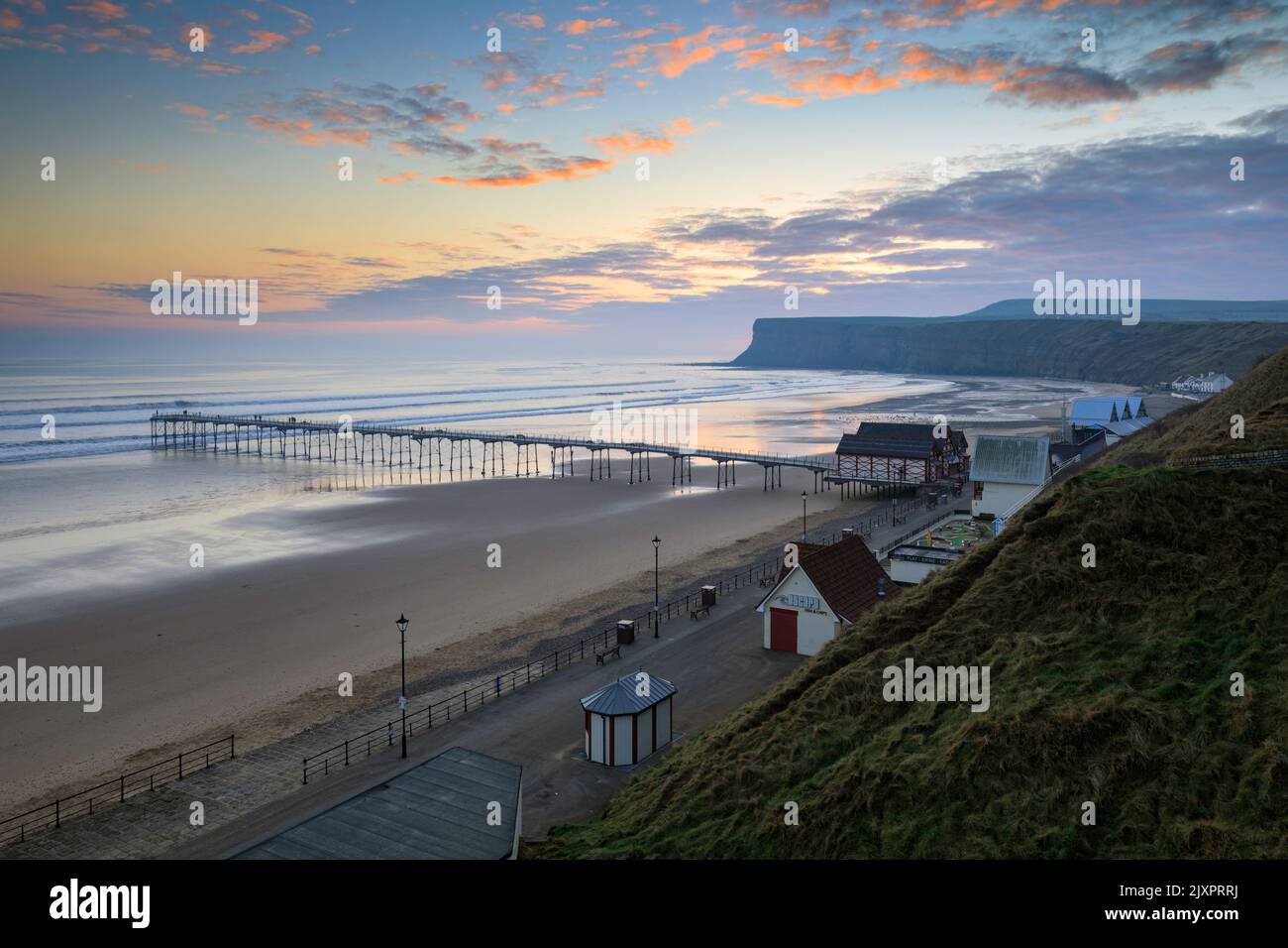 Saltburn Pier and beach captured at sunrise from a high vantage point ...