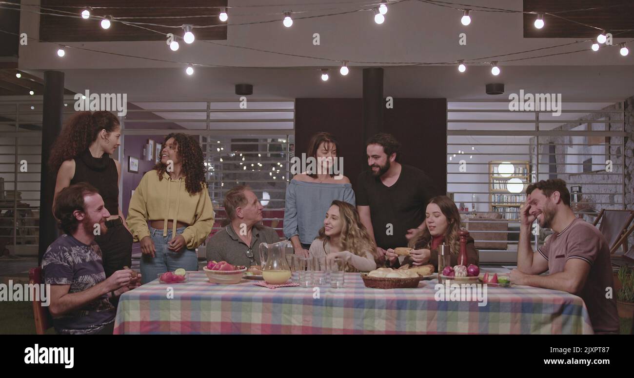 Family gathered around dining table hi-res stock photography and images ...
