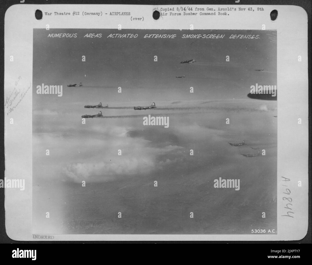 Boeing B-17 Flying Fortresses leave vapor trails while numerous areas ...