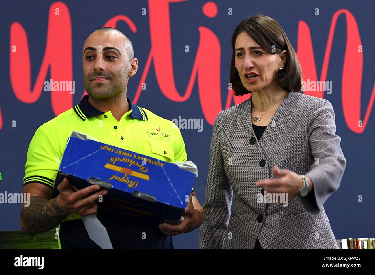 Auction winner Bobby Tesoriero is seen with NSW Premier Gladys ...