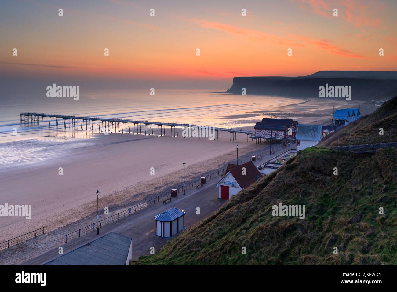 Saltburn Pier and beach captured at sunrise from a high vantage point ...