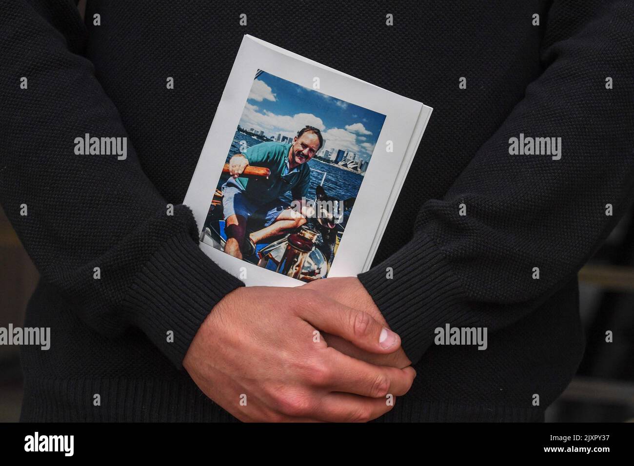 An order of service is seen during the State Memorial service for Clean ...