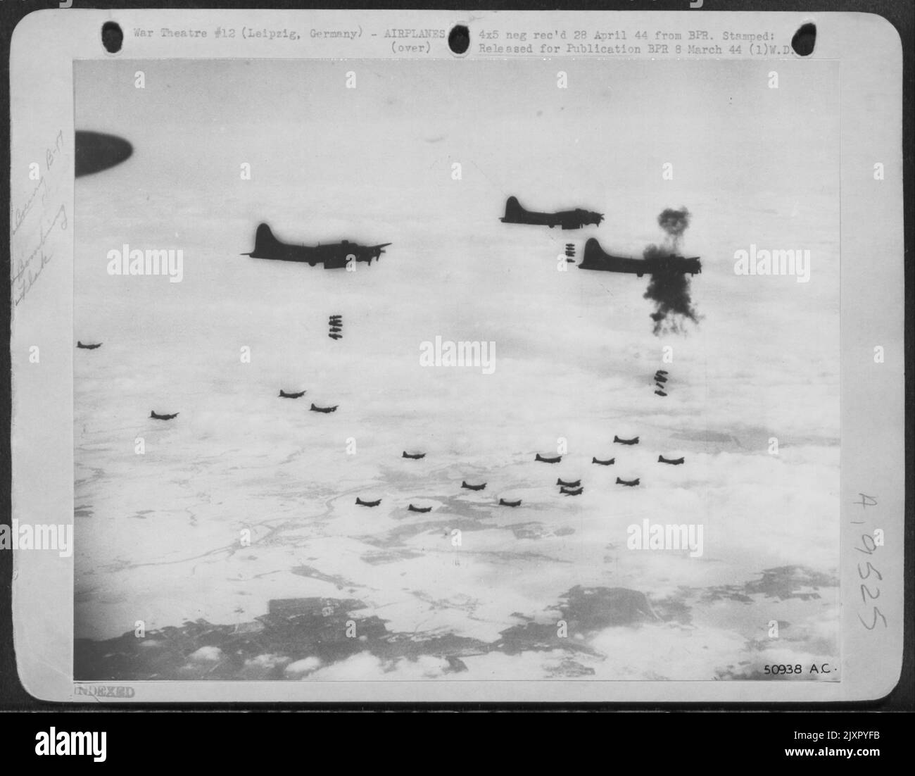 BOMBS AND FLAK: As flak burst near the lead plane, 8th AAF Flying ...