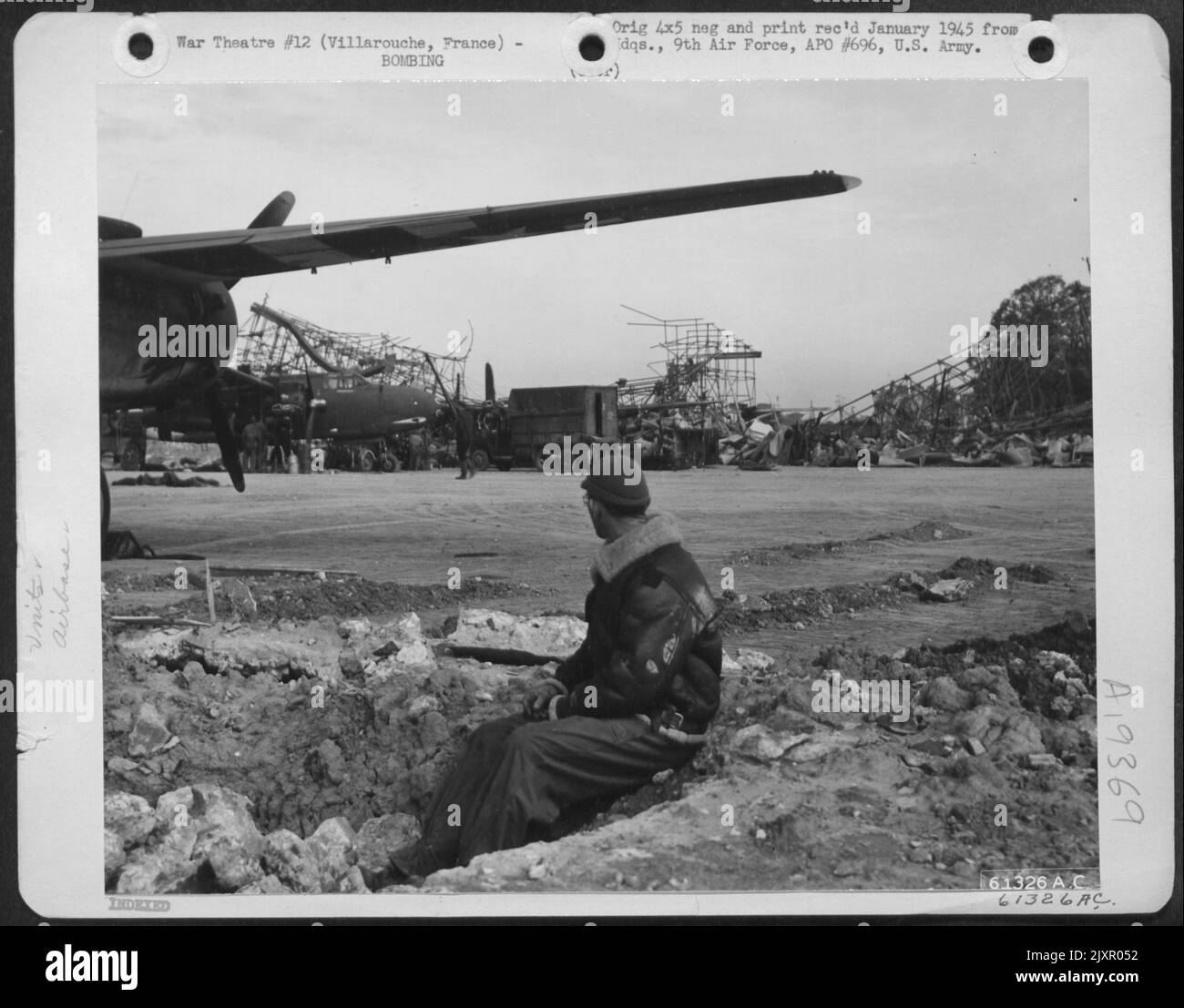 A Gi Sits In A Partially Filled Bomb Crater As He Looks Over A Section ...