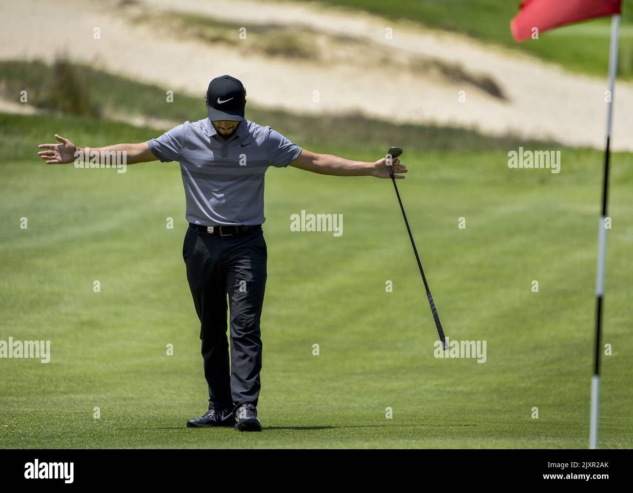 Mexican golfer Abraham Ancer reacts after chipping in on the fourth ...