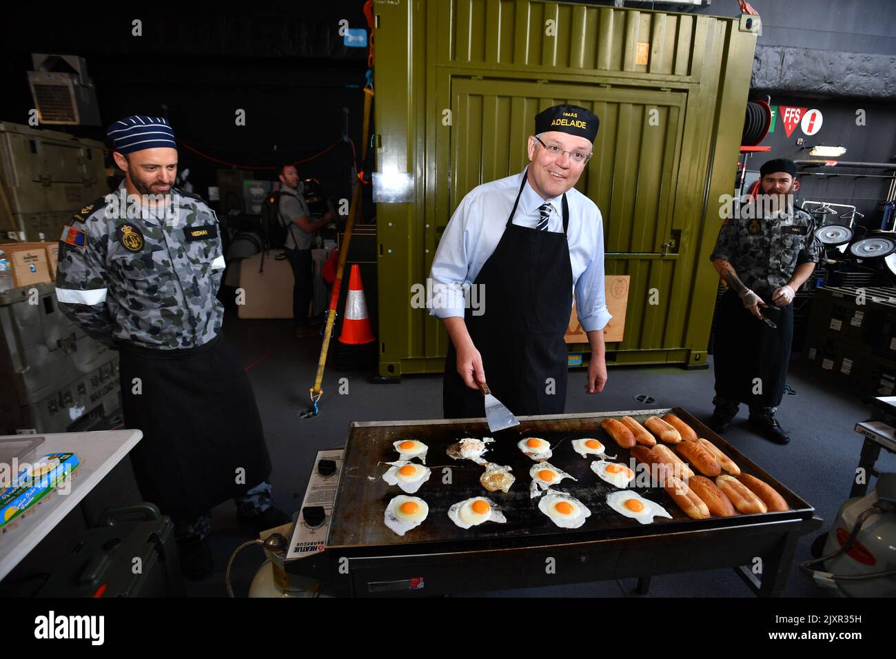 Prime Minister Scott Morrison cooks breakfast on the Canberra class ...