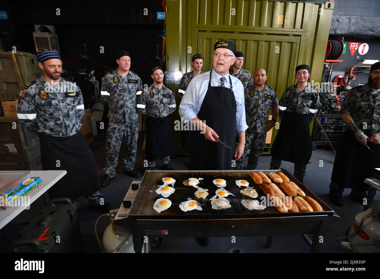 Prime Minister Scott Morrison cooks breakfast on the Canberra class ...