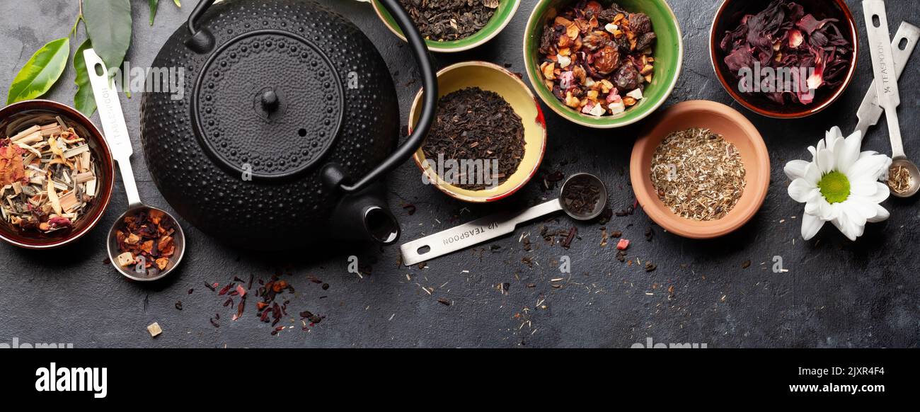 Various dried tea and teapot. Top view flat lay Stock Photo - Alamy