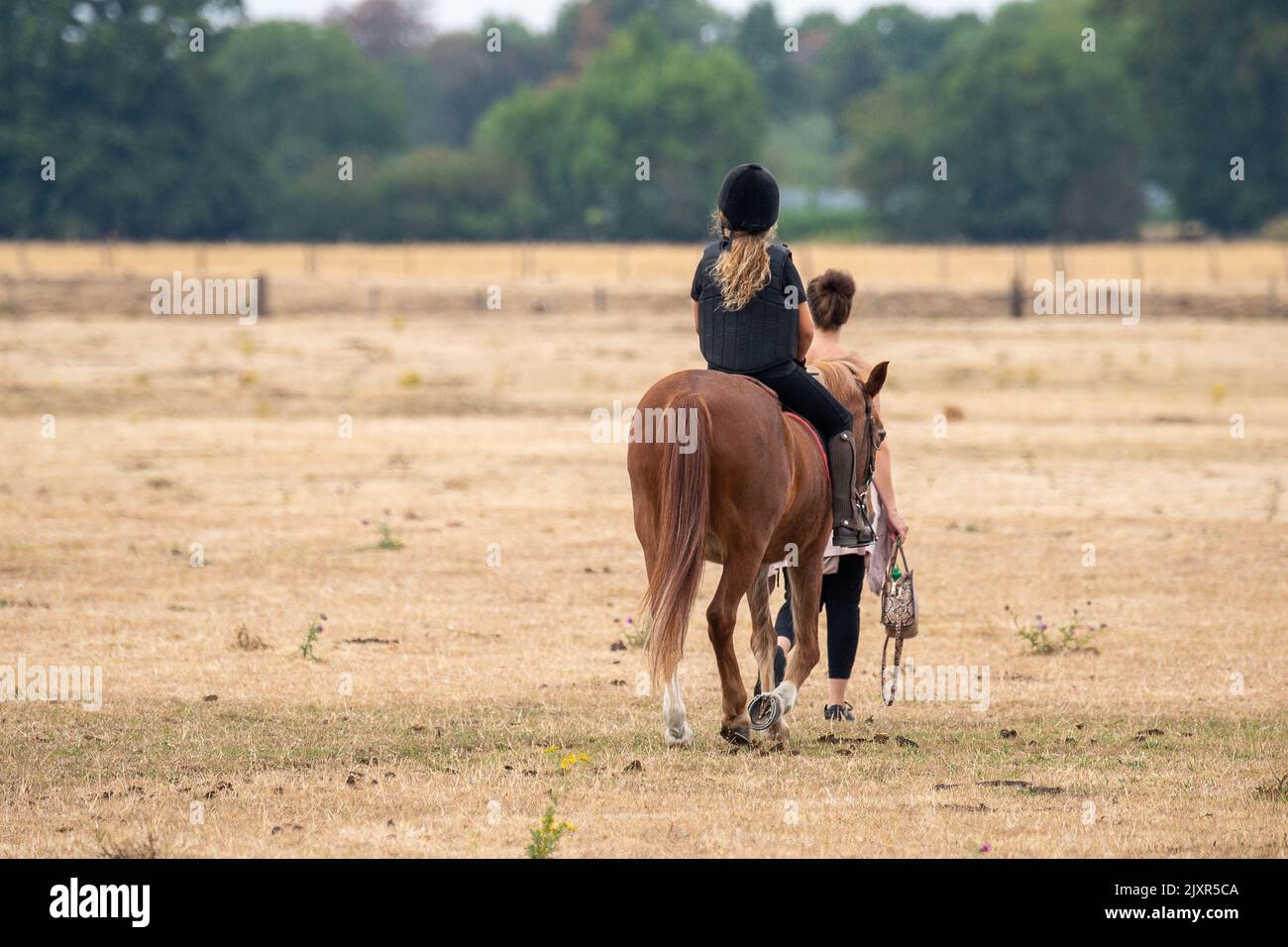 Dorney, Buckinghamshire, UK. 16th August, 2022. A girl rides a horse ...