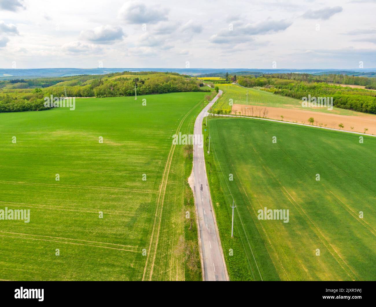 Aerial view of agriculture fields, meadow and road inside. Rural scene ...