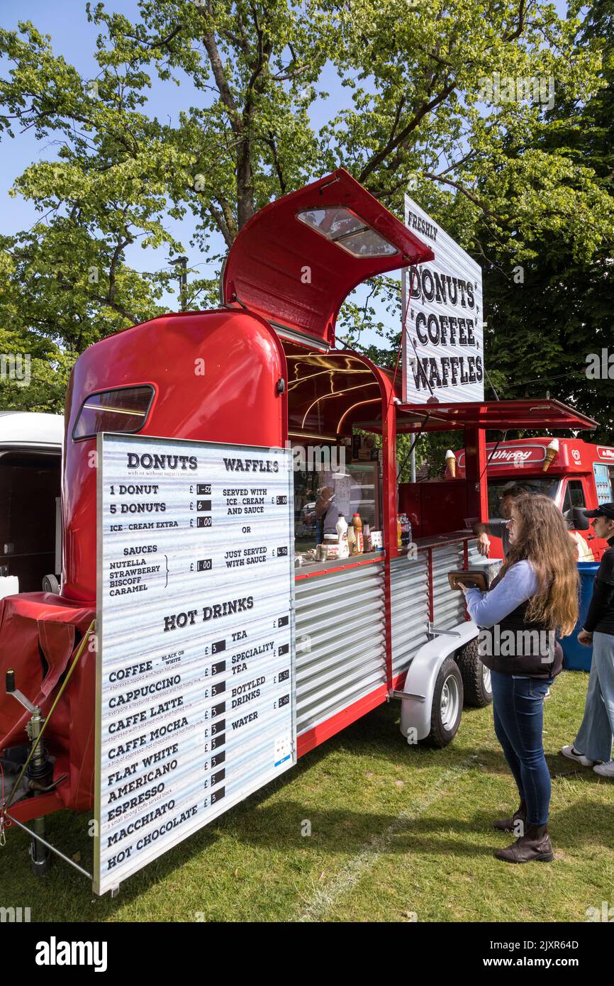 Bright red food and drink trailer at an outdoor event, England Stock ...