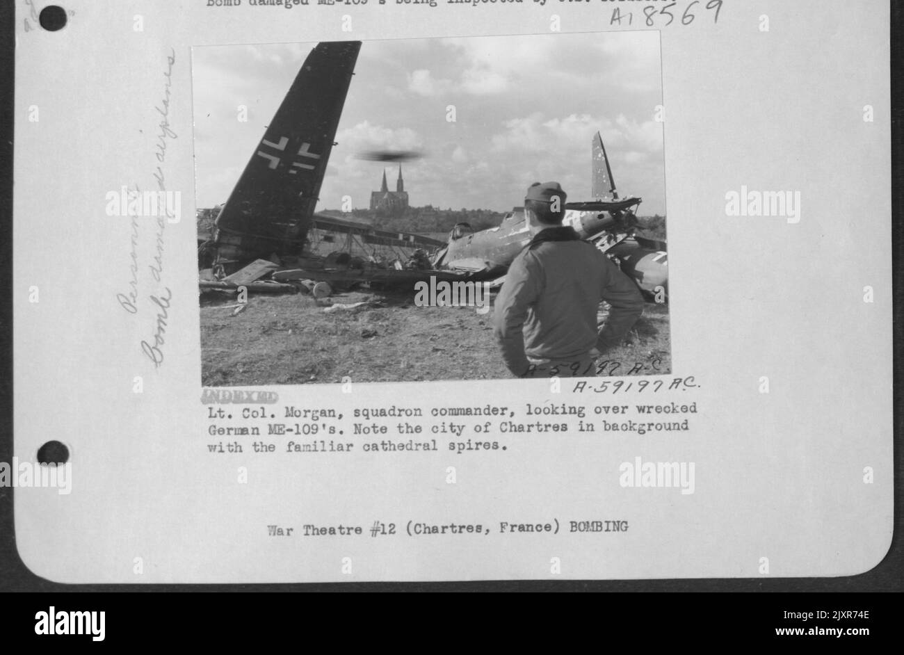Lt. Colonel Morgan, Squadron Commander, Looking Over Wrecked German Me ...