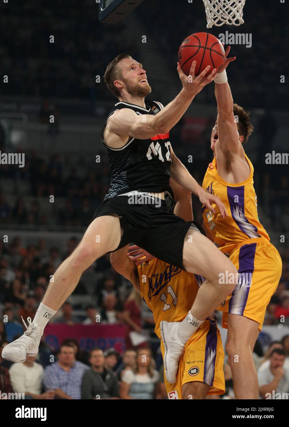 David Barlow of Melbourne (left) under pressure from Dane Pineau of ...