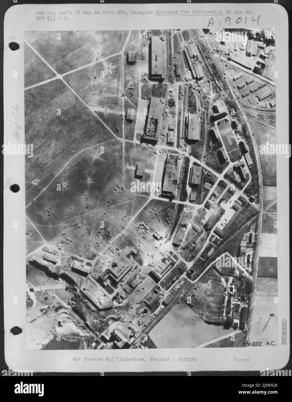 Gaping holes from direct hits can be seen in four large hangars at the ...