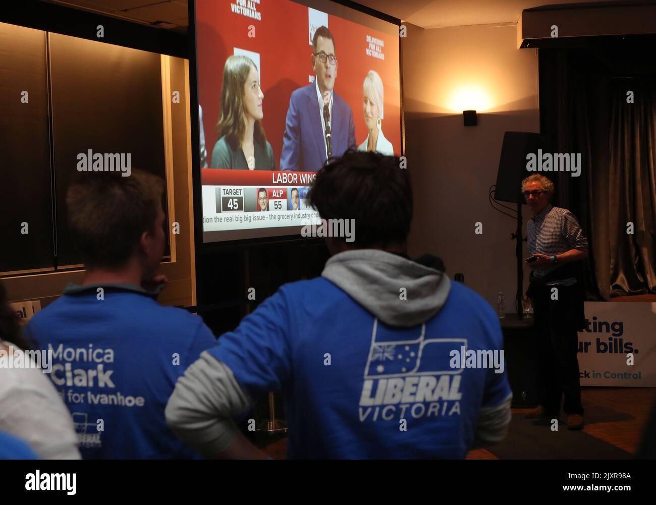 Liberal party members watch Daniel Andrews Labor victory speech during ...