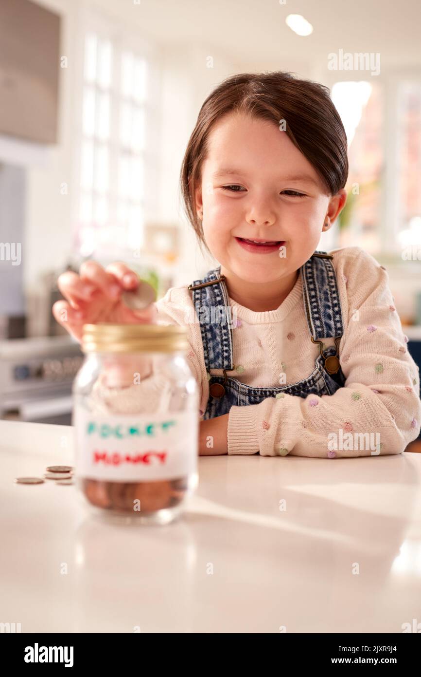 Girl money jar hi-res stock photography and images - Alamy