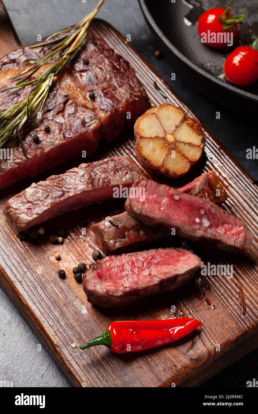 Grilled ribeye beef steak with herbs and spices Stock Photo - Alamy