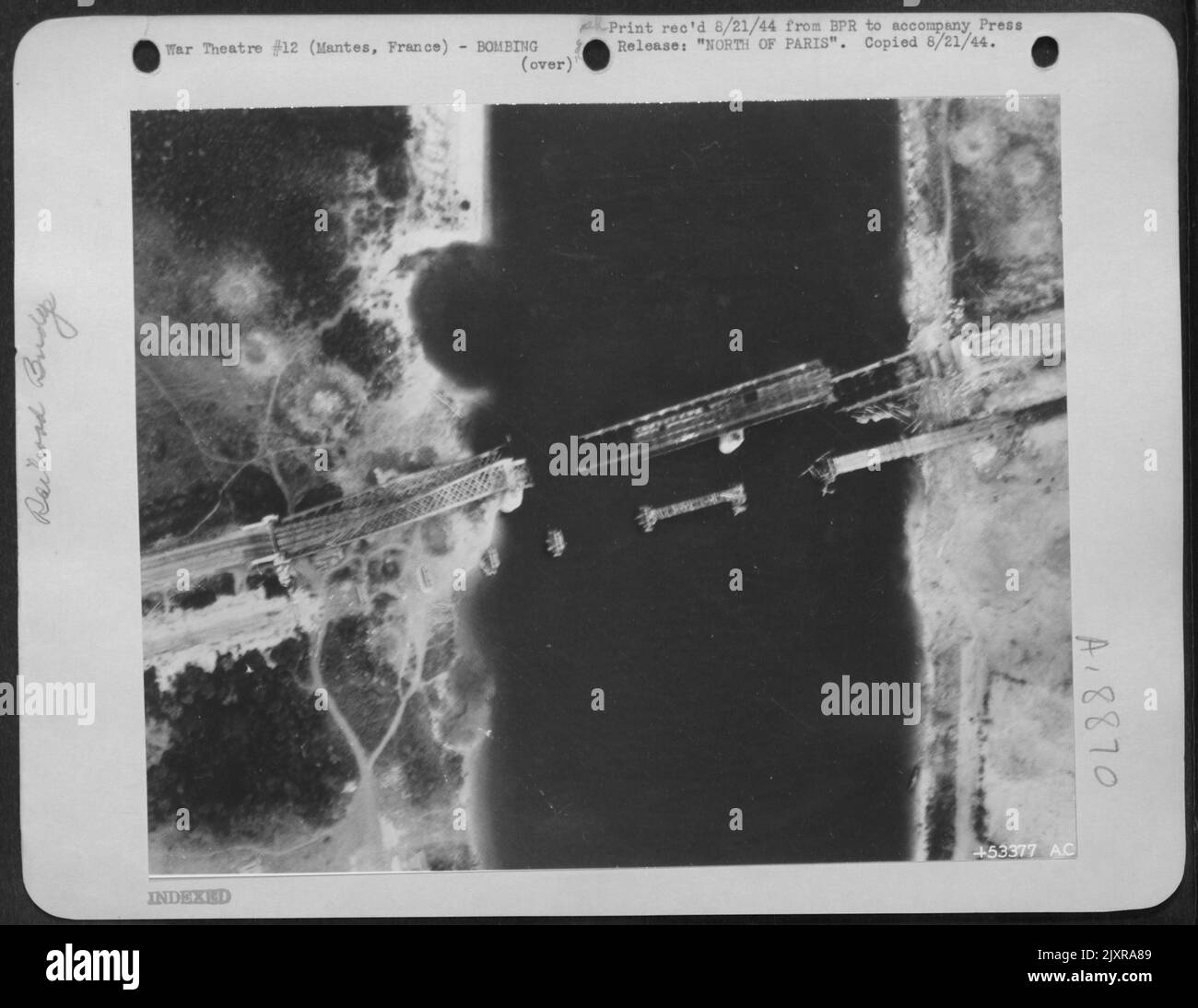 The 9th USAAF bombed this railway bridge at Mantes. This town, just ...