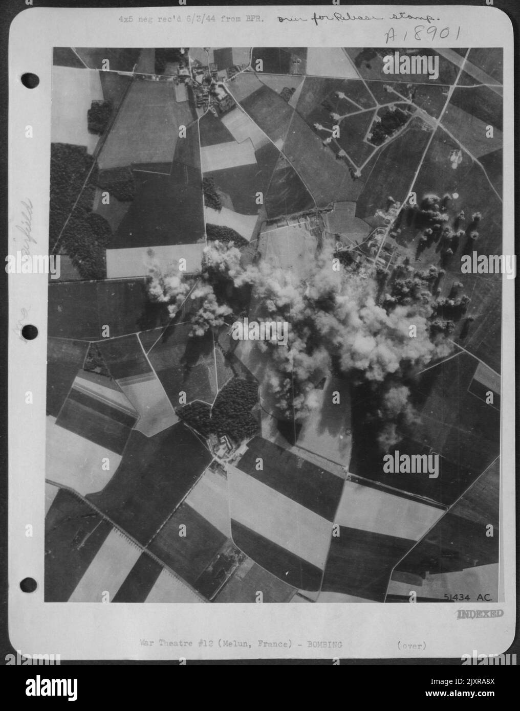 BOMB BURSTS BLANKET ANOTHER NAZI TARGET, as Consolidated B-24 Liberators smother the oil dumps ...