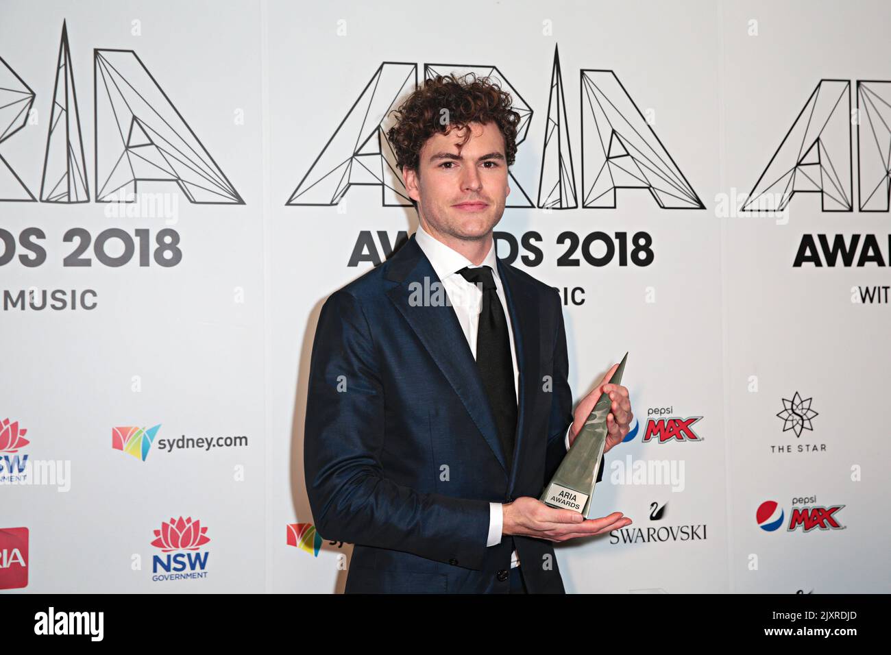Vance Joy poses for a photograph after winning adult contemporary album ...