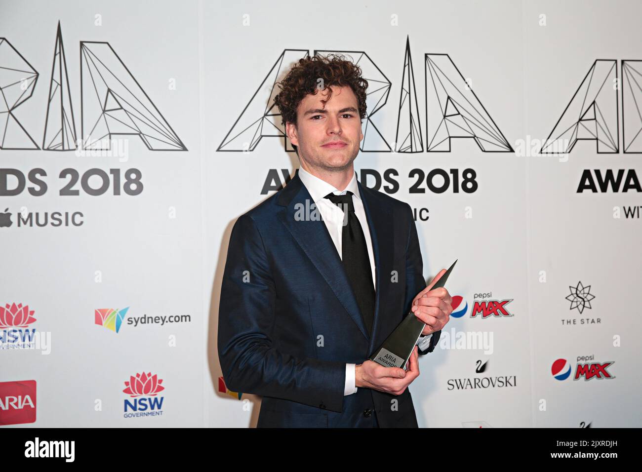 Vance Joy poses for a photograph after winning adult contemporary album ...