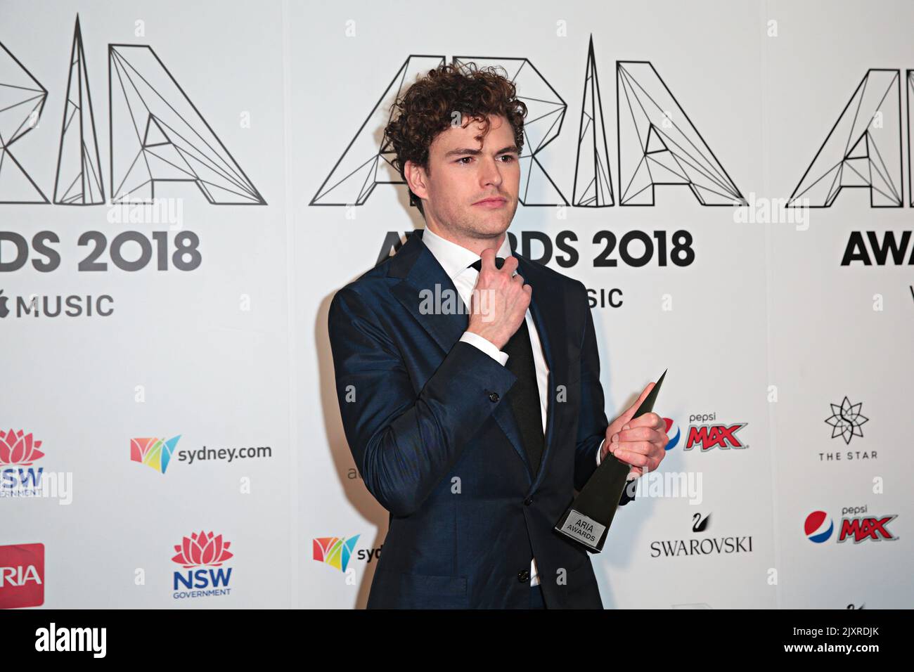 Vance Joy poses for a photograph after winning adult contemporary album ...