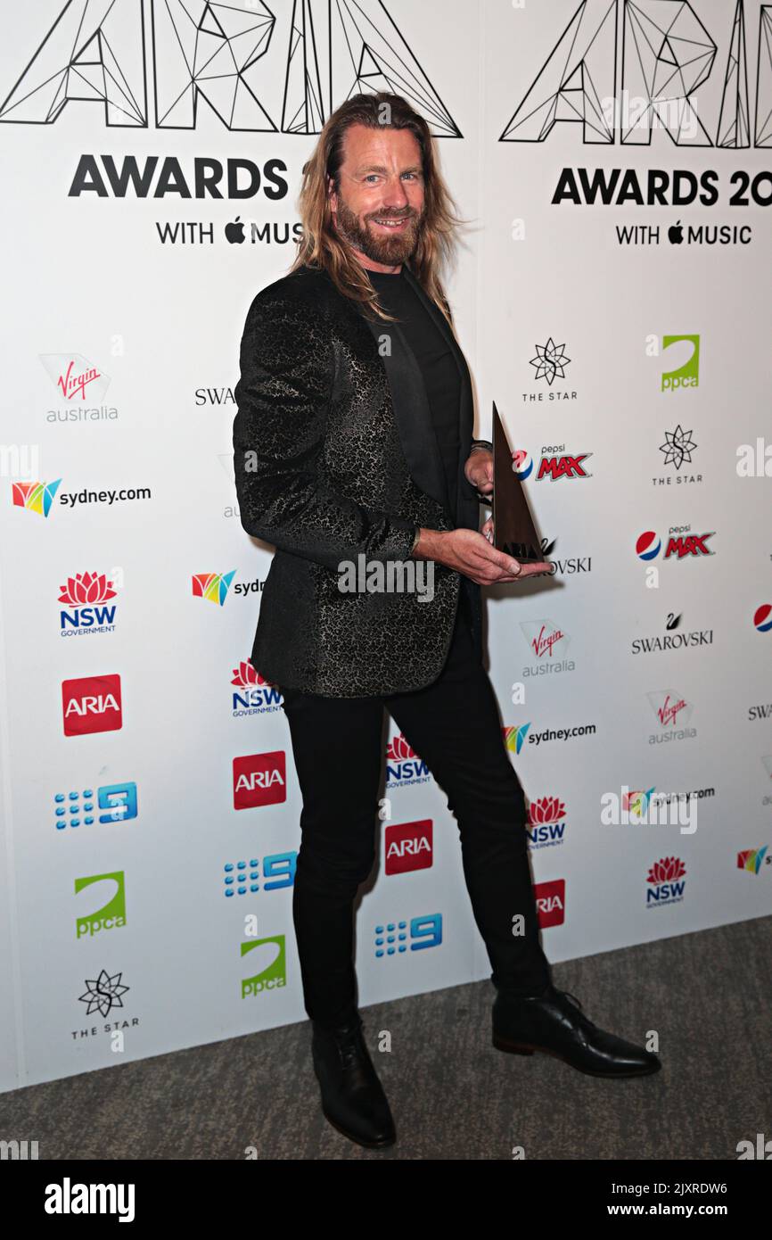 Scott Maxwell poses for a photograph after winning the Music Teacher of ...