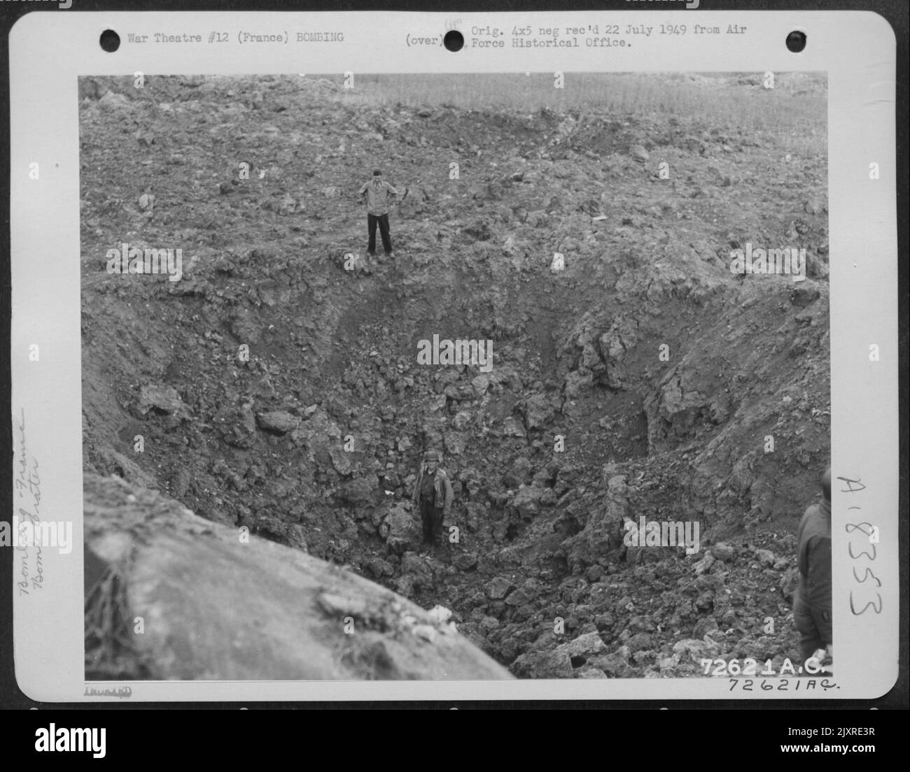 An Officer Stands In The Center Of One Of The Many Bomb Craters On ...