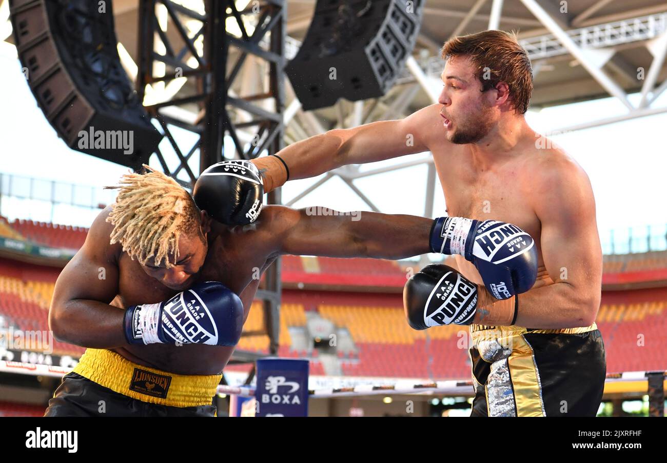 Joseph Goodall (right) of Australia lands a punch on Christian Ndzie ...