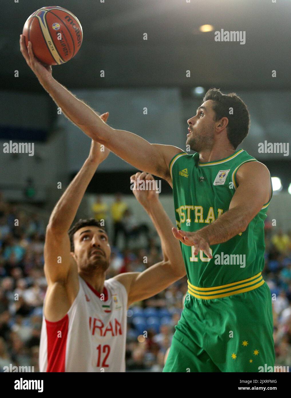Todd Blanchfield of Australia (right) lays up under pressure from ...